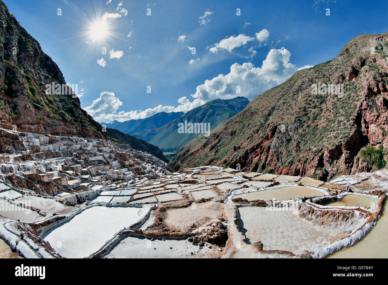 Salt pans and sunburst, Maras Salt Mines (Salineras de Maras), near ...