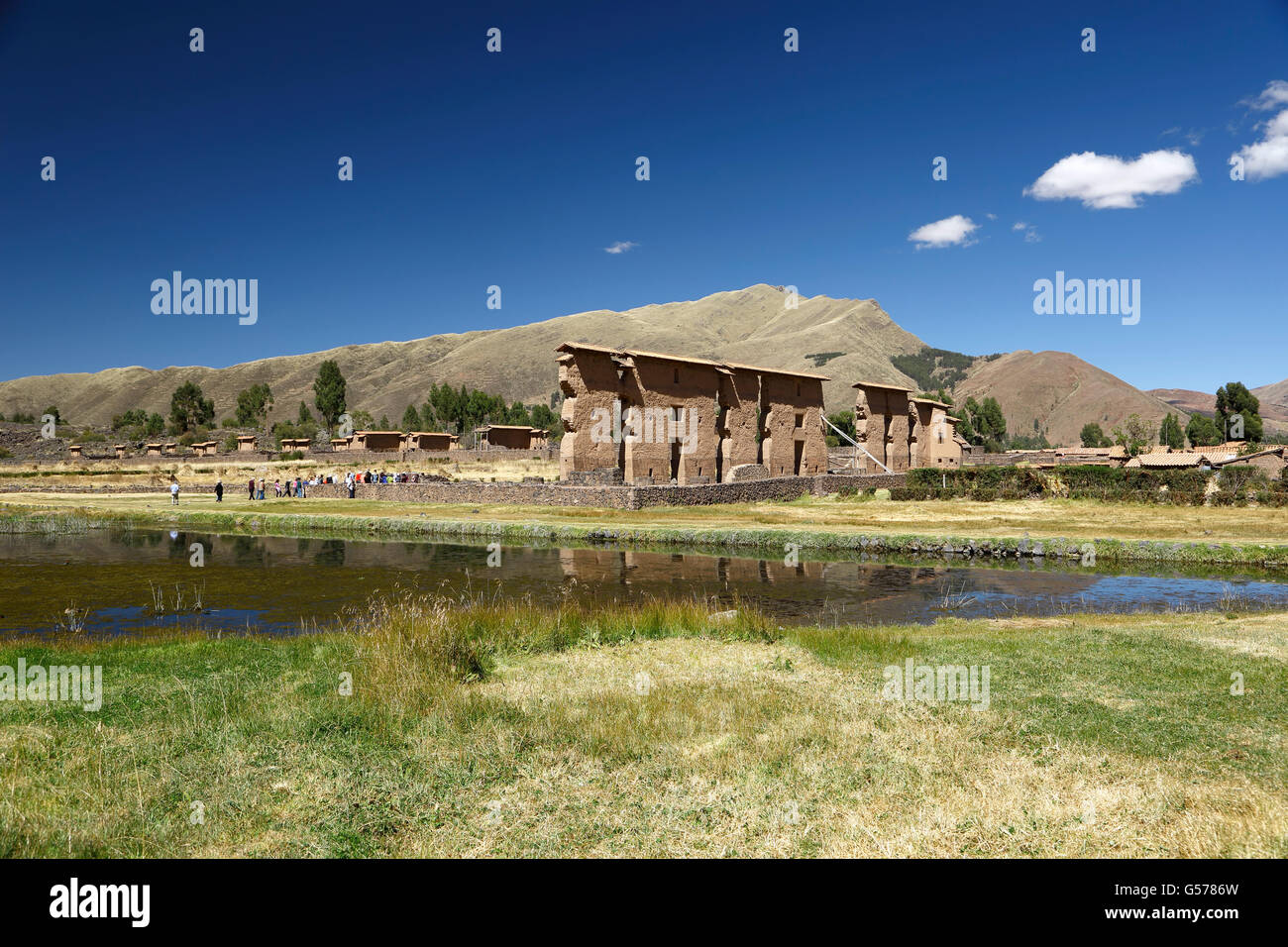Brick walls of temple reflected on pond, Inca ruins, Raqchi, Cusco ...
