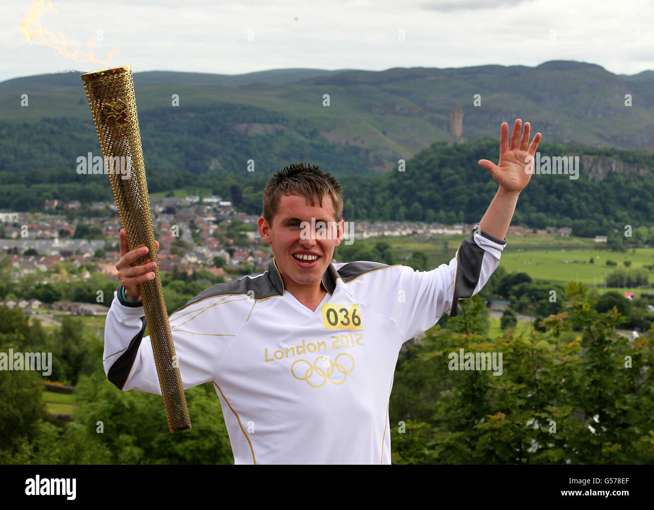 Olympic Torch Bearer Paul Mcintyre with the Olympic flame at Stirling ...