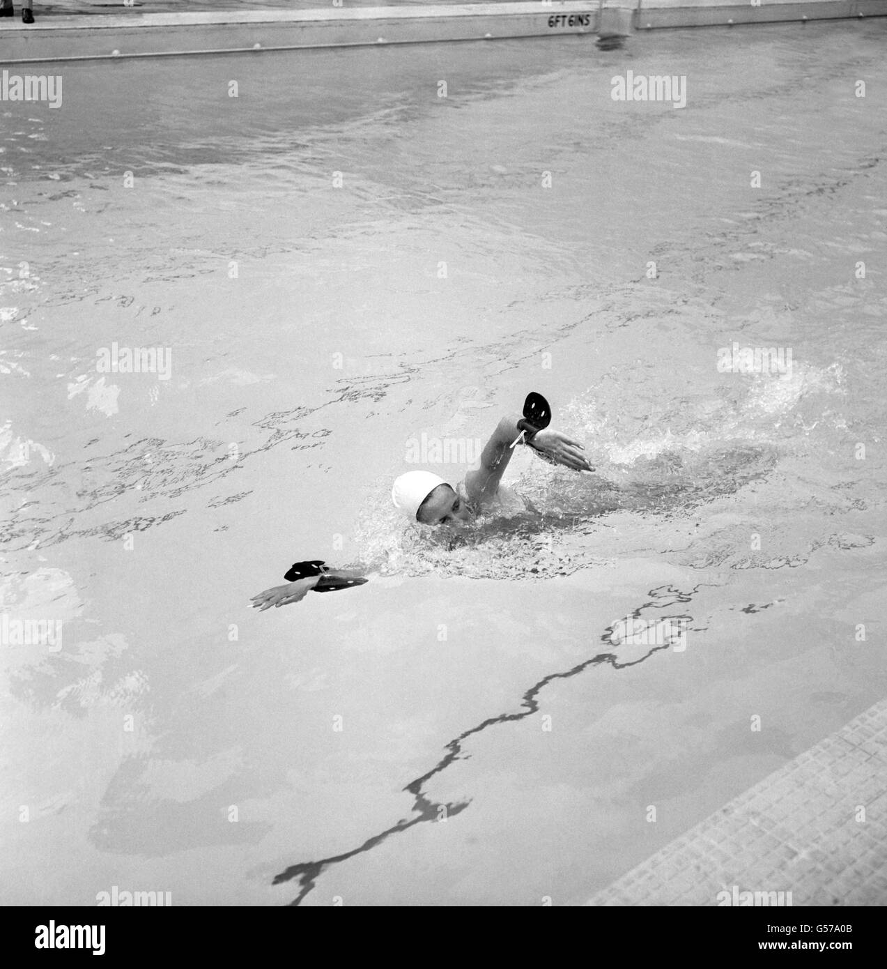 Olympic swimmer Anita Lonsbrough demonstrating a new arm aid for ...