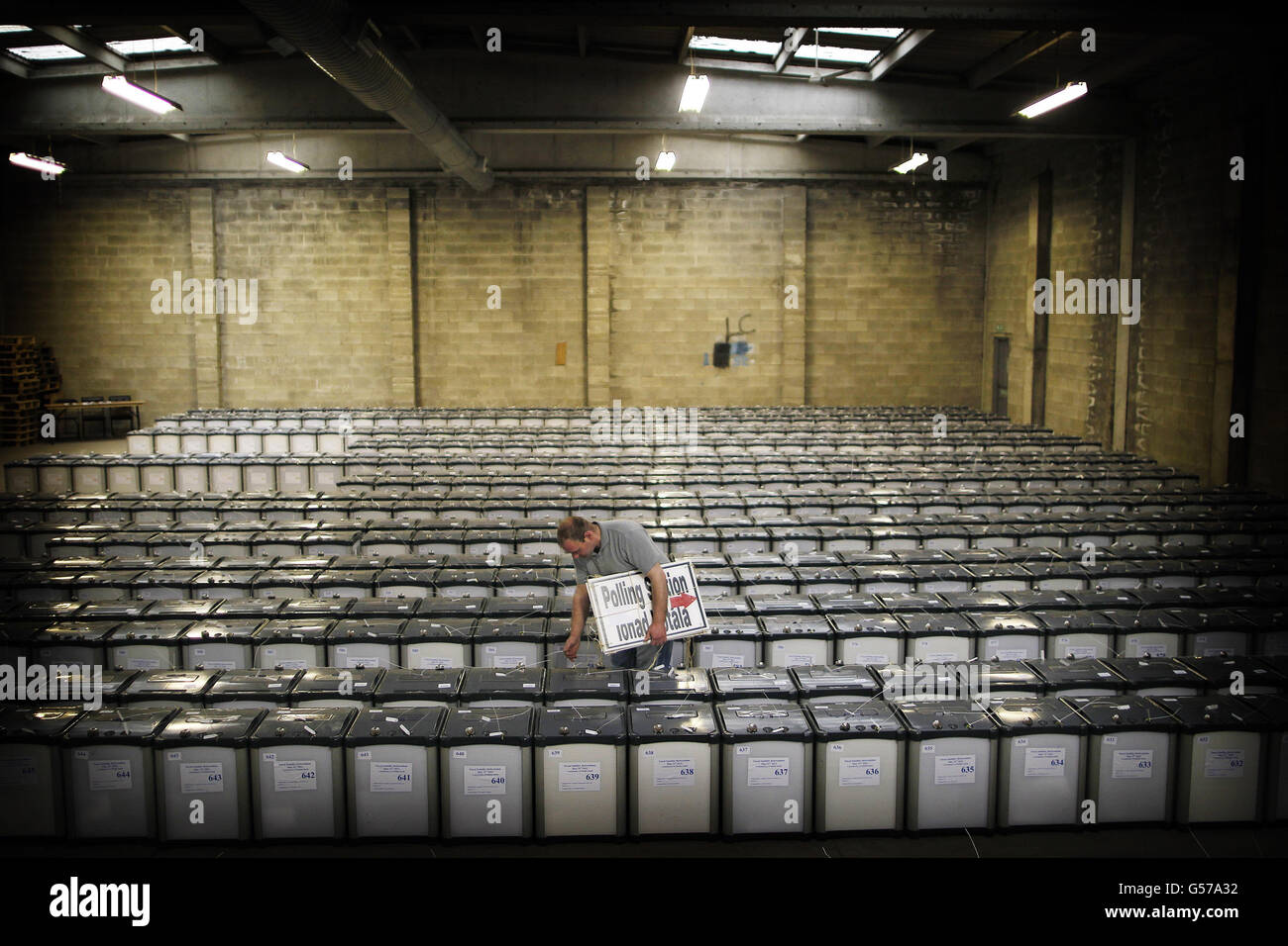 Election Warehouse manager Mick Leonard checks the seals on top of ...