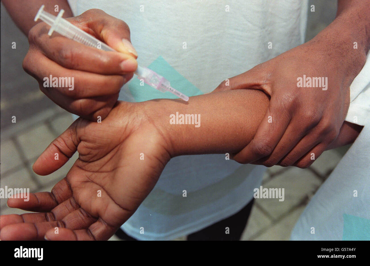 A student nurse displays a needle with a safety guard at the Florence ...