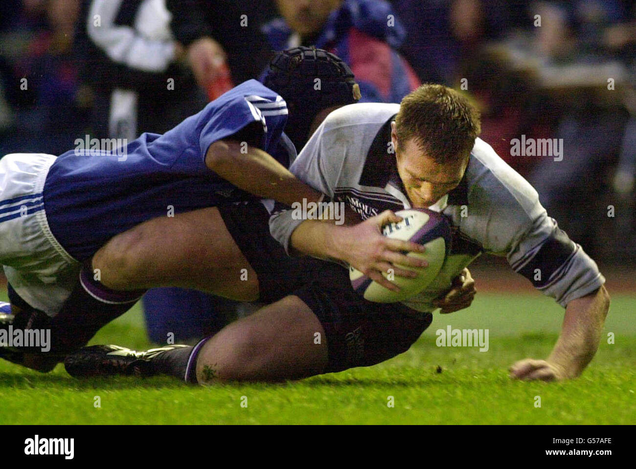 Scotland`s John Petrie (with ball) scores the first try as Samoa`s ...