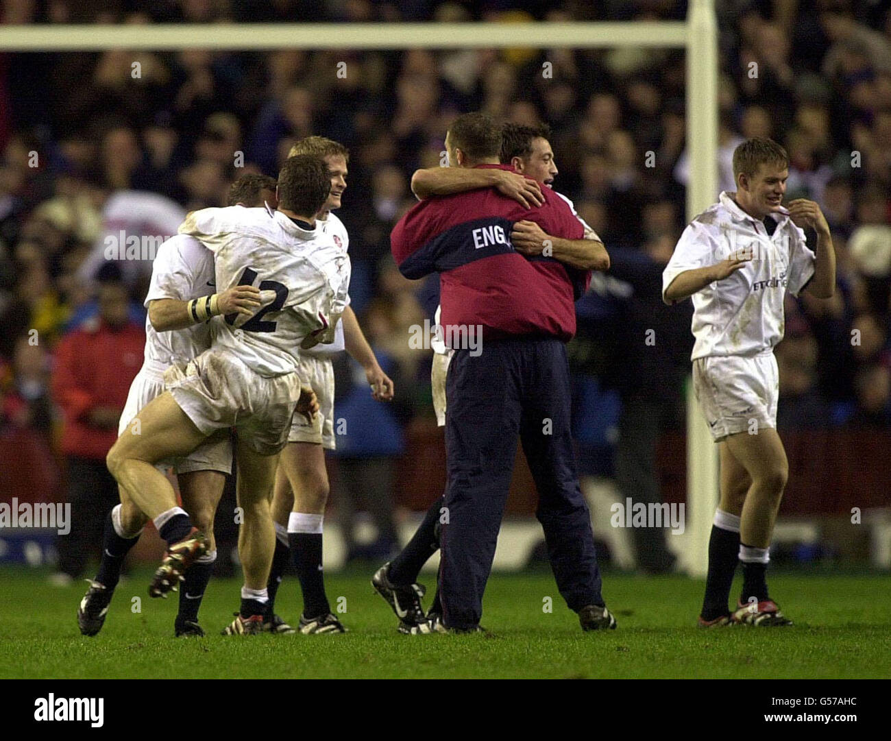 England's Dan Luger (centre) hugs a team mate after defeating Australia ...