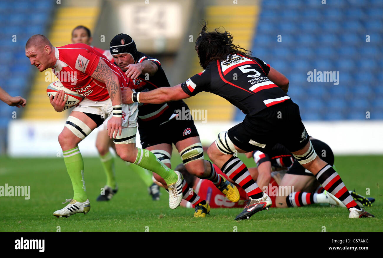 London Welsh's Lee Beach breaks through the tackles of the Cornish ...