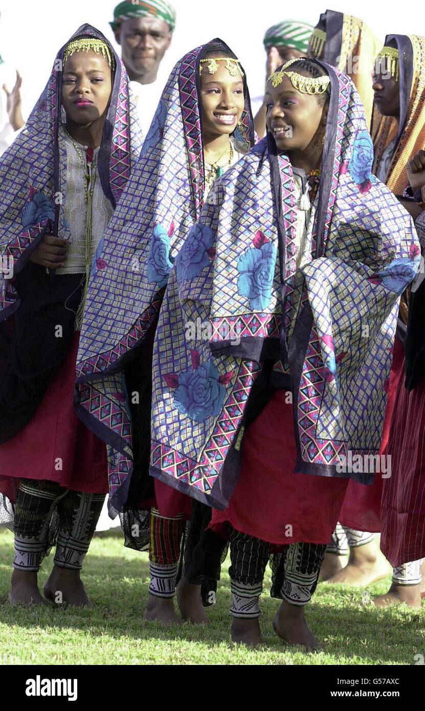 A group of young Oman girls, wearing traditional headress and clothes ...
