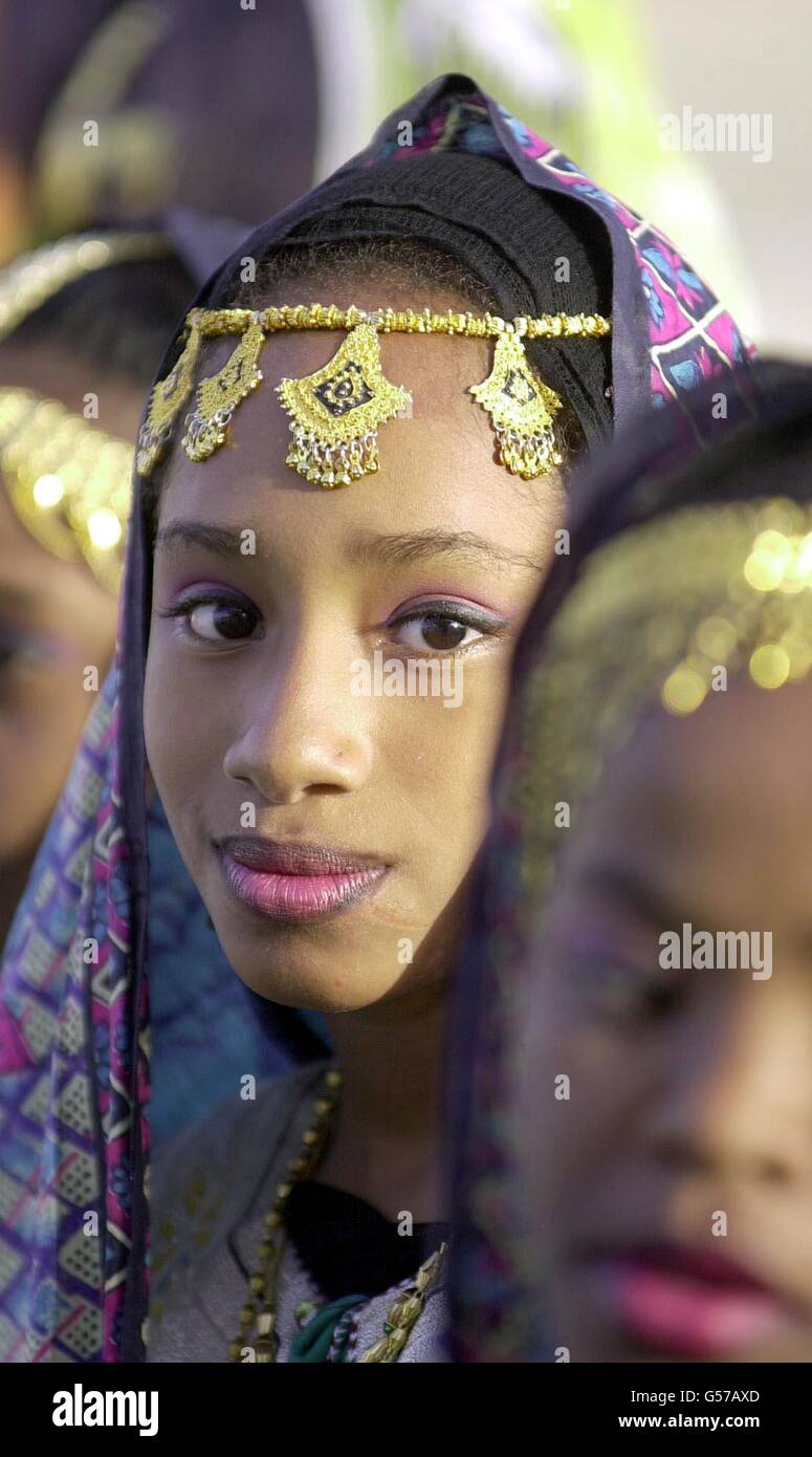 A young Oman girl, wearing traditional headress and clothes, during the ...