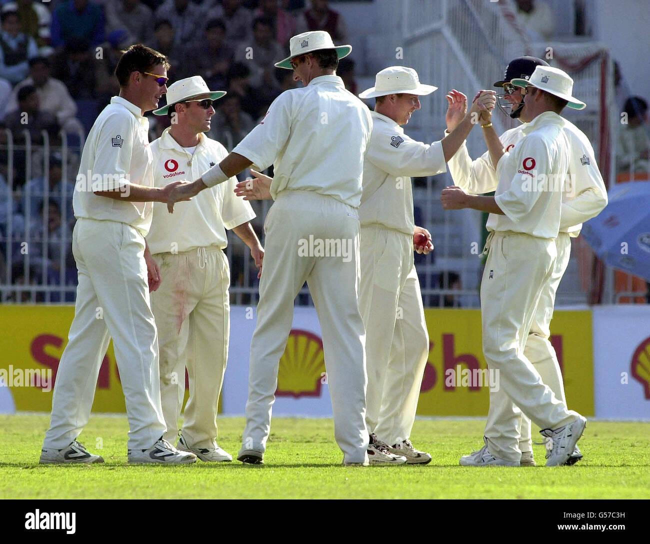 England players congratulate Ashley Giles (left) and Michael Atherton ...