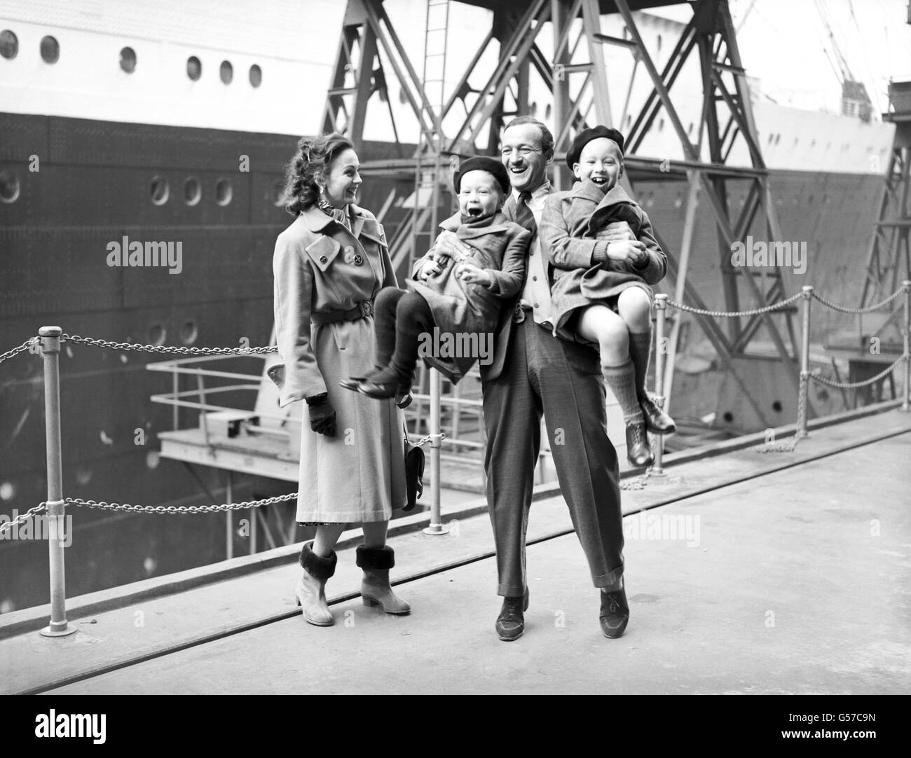 Film actor David Niven gives his sons, Jamie, left, and David, an ...