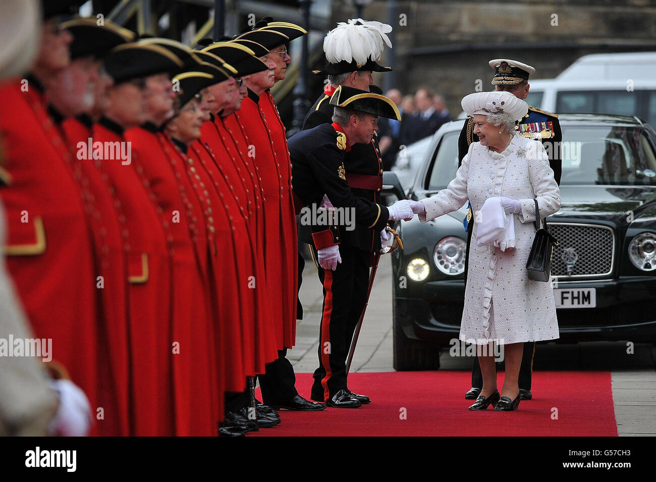 Queen Elizabeth II and Prince Philip, Duke of Edinburgh are greeted by ...