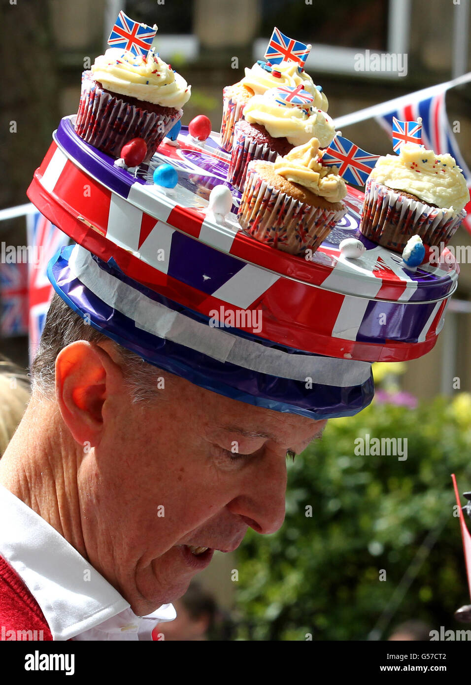 Mike Dawson wears a tea cake hat at a street party in Murrayfield ...
