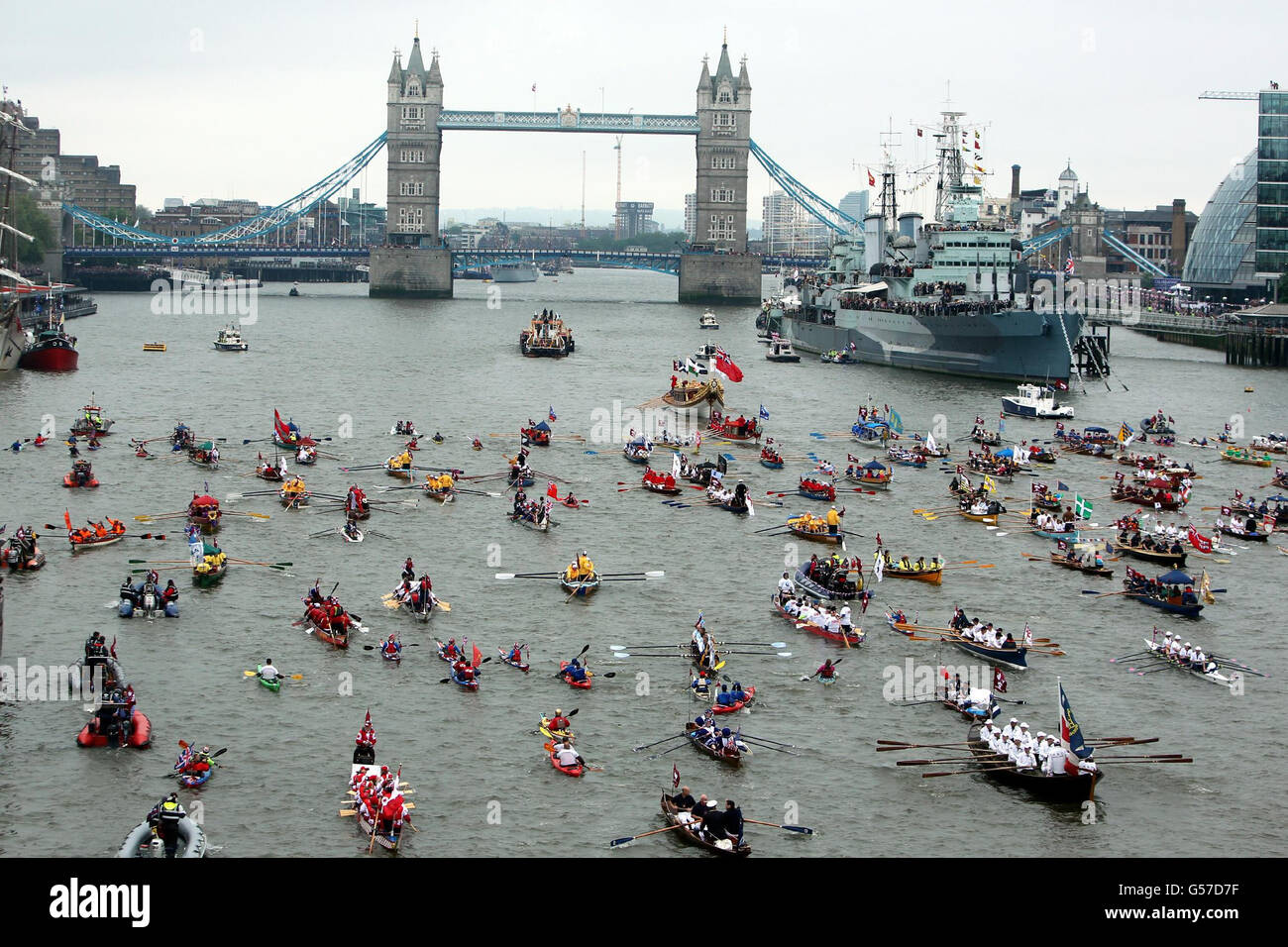 A flotilla of boats make their way towards Tower Bridge, during the ...
