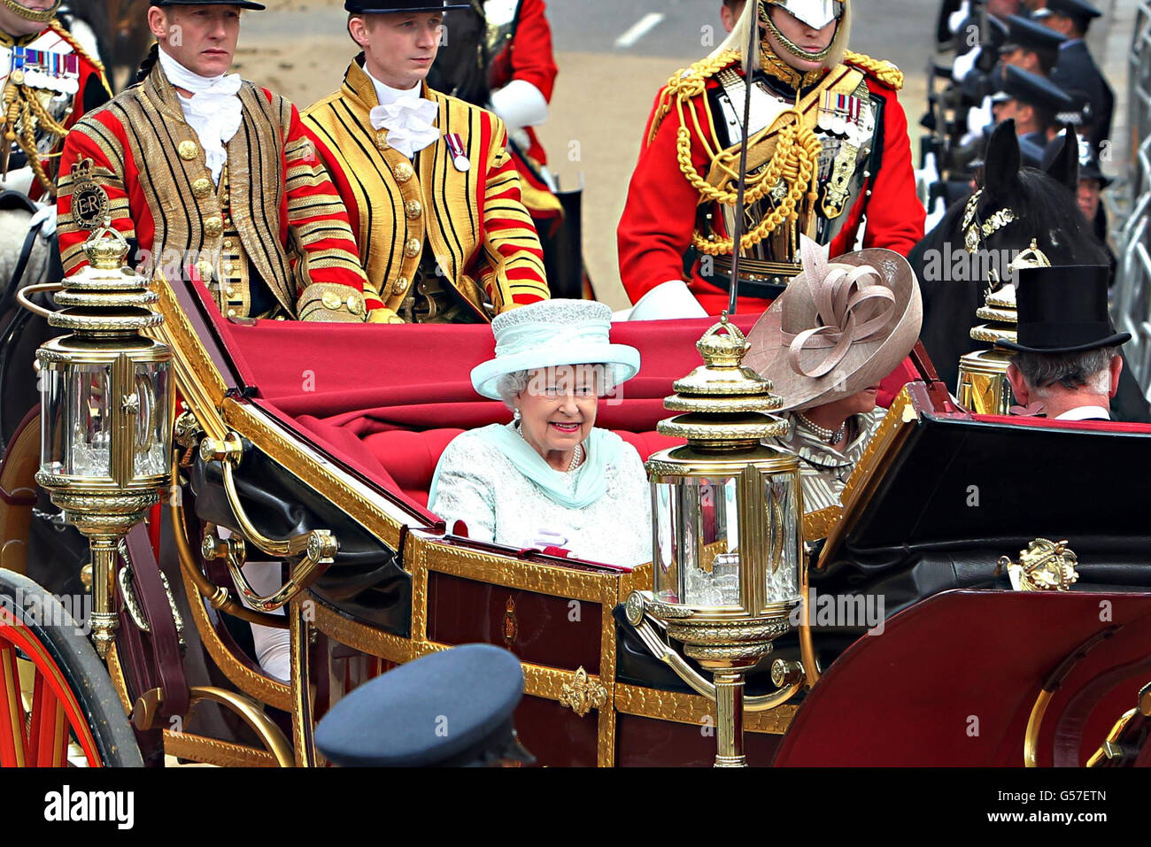 Queen Elizabeth II in her carriage on her way back to Buckingham Palace ...