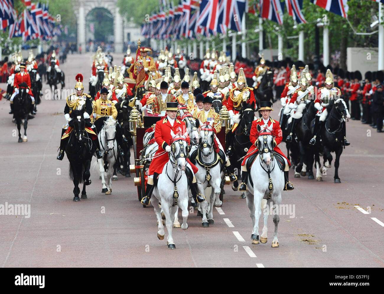The State Coaches carrying members of the Royal Family arrives at ...
