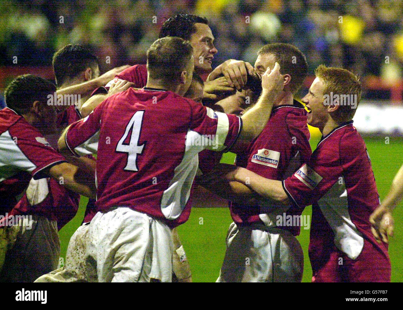 Morecambe's Mark Quayle is mobbed by team mates after scoring the ...