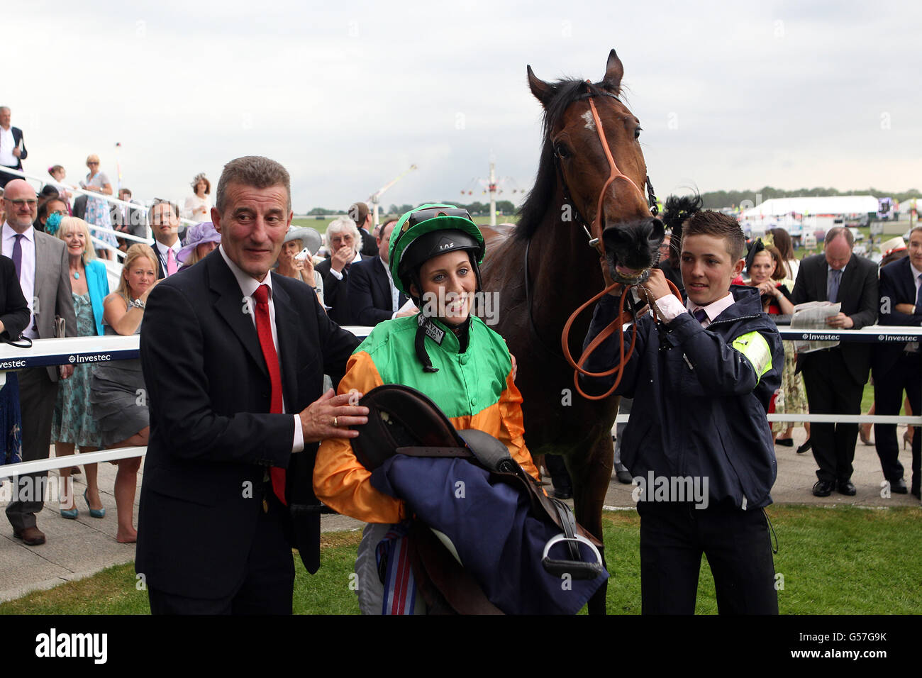 Jockey Amy Ryan with her father, trainer Kevin Ryan after she rode ...