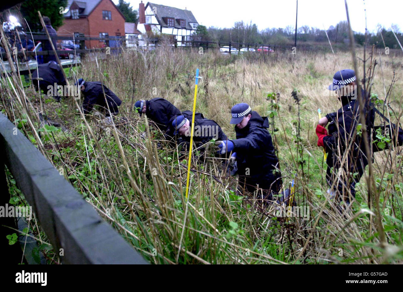 Police officer policeman searching field hedge hi-res stock photography ...