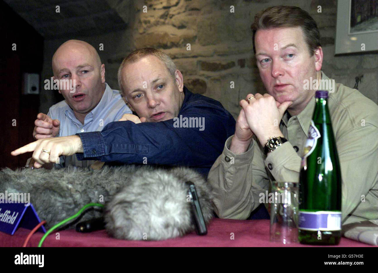 Injured boxer Paul Ingle's trainer Steve Pollard (L), manager Frank ...