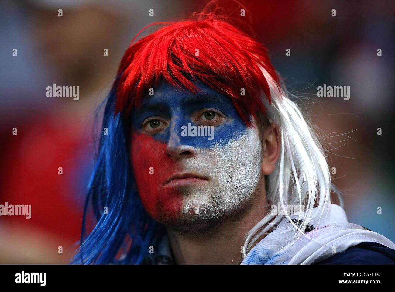 A Czech-Republic fan with a painted face shows his support in the ...