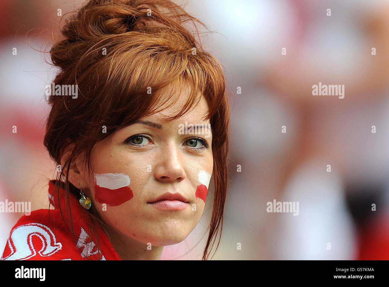 A Poland fan shows support for her team in the stands Stock Photo - Alamy