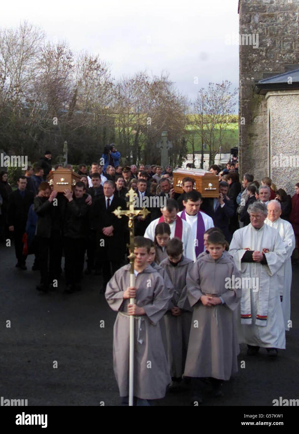 Family and friends follow the coffins of Louise McAloon, 12, and her ...