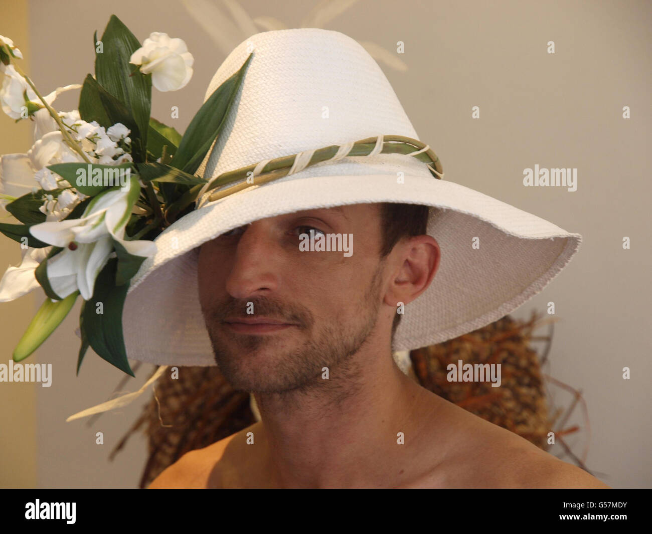 A model wears Designer David Shilling's latest hat creations in London ...