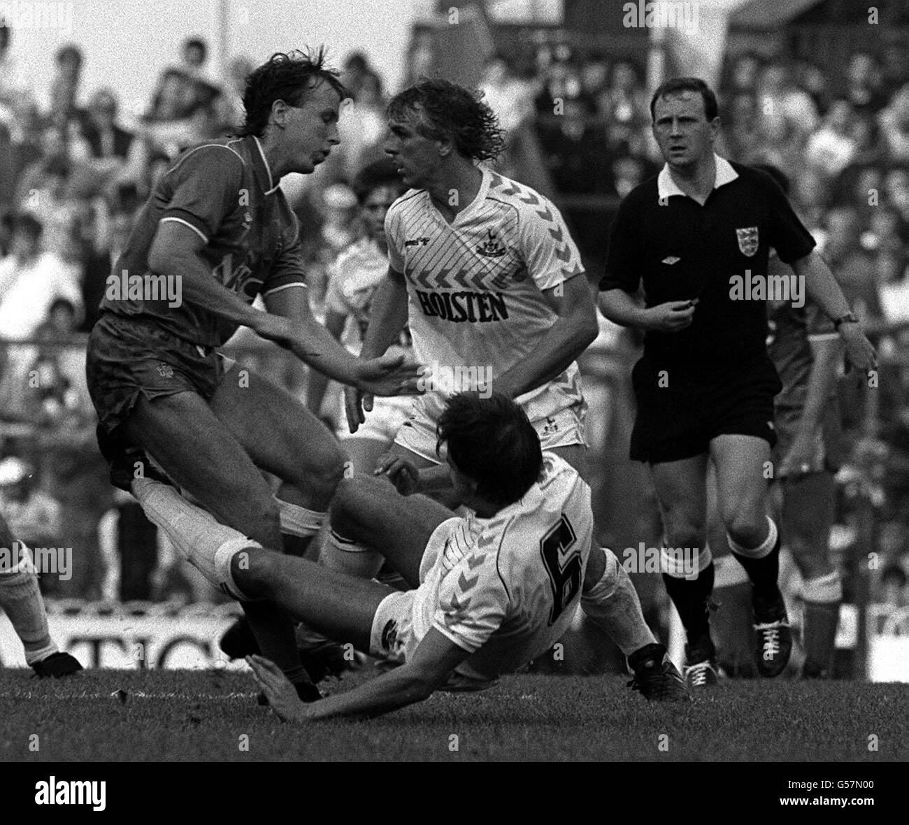 Tottenham Hotspur's Gary Mabbutt (No 6) goes down after tackling ...