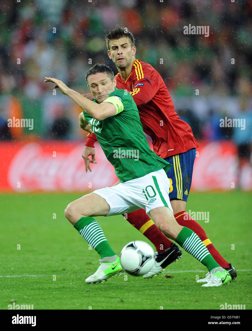 Spain's Gerard Pique and Republic of Ireland's Robbie Keane Stock Photo ...