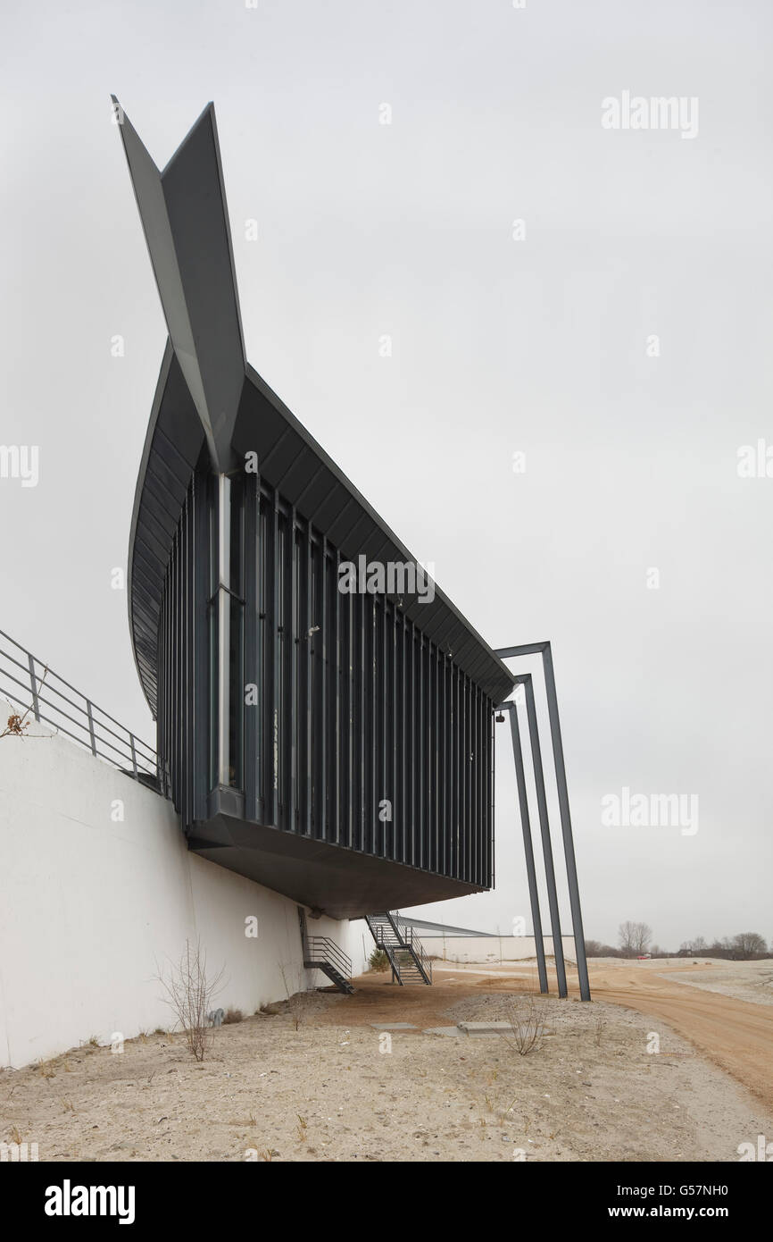 Exterior view of restaurant with sand dunes against cloudy sky (prior ...