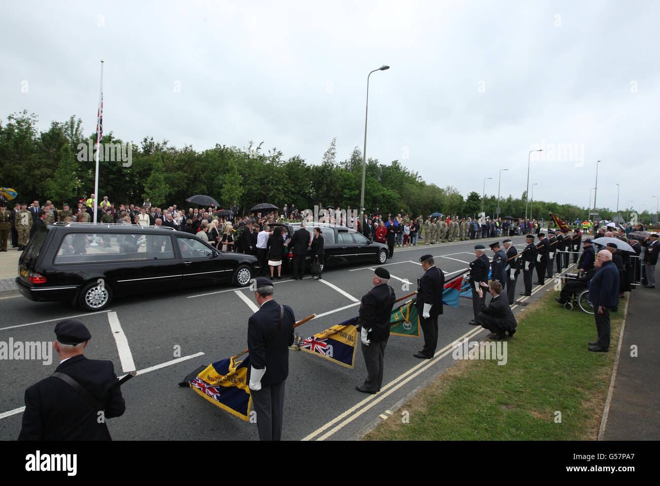 Mourners pay their respects to Captain Stephen Healey from the 1st ...