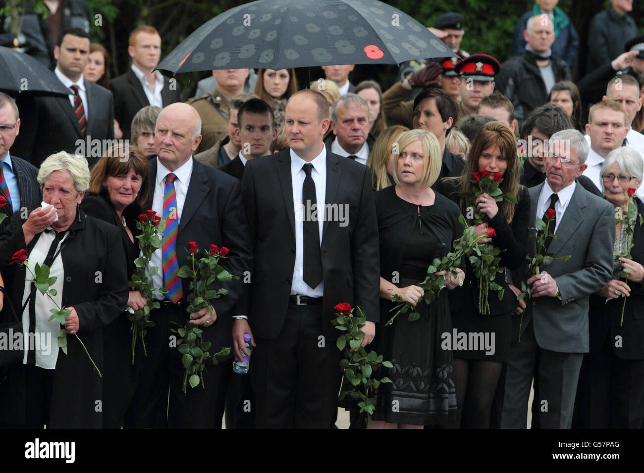 Mourners wait to pay their respects to Captain Stephen Healey from the ...
