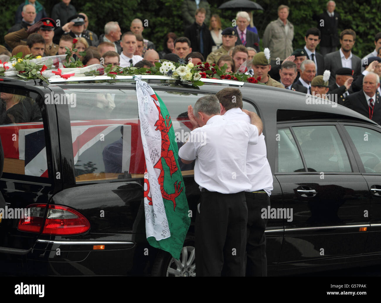 Mourners pay their respects to Captain Stephen Healey from the 1st ...