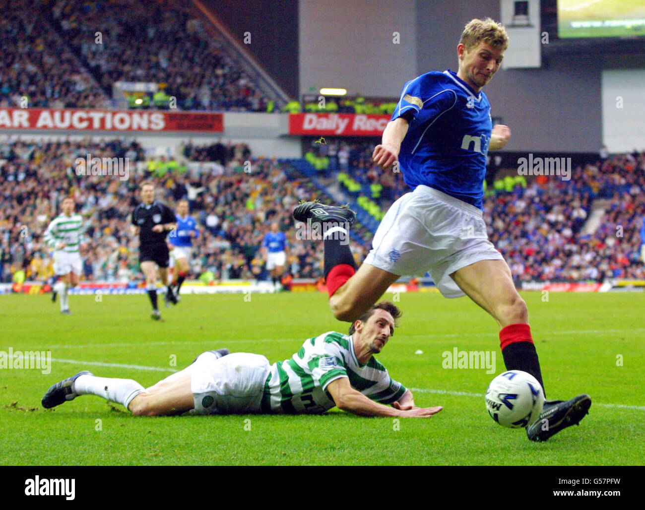 Rangers Tore Andre Flo (right) takes the ball around Celtic's Stephane ...