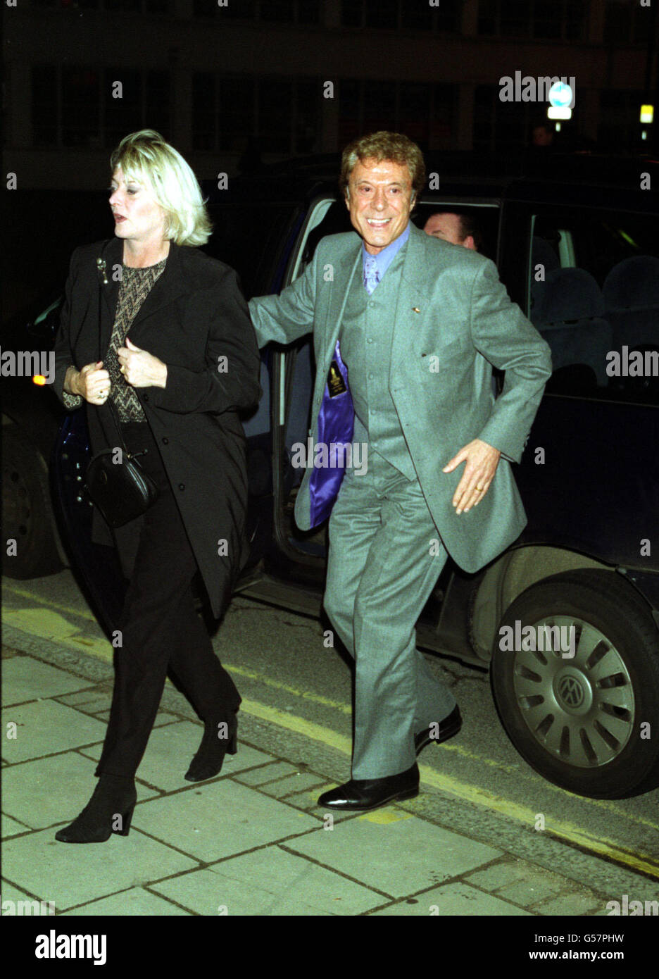 Celebrity tap dancer getting out car smiling grey suit waistcoat hi-res ...