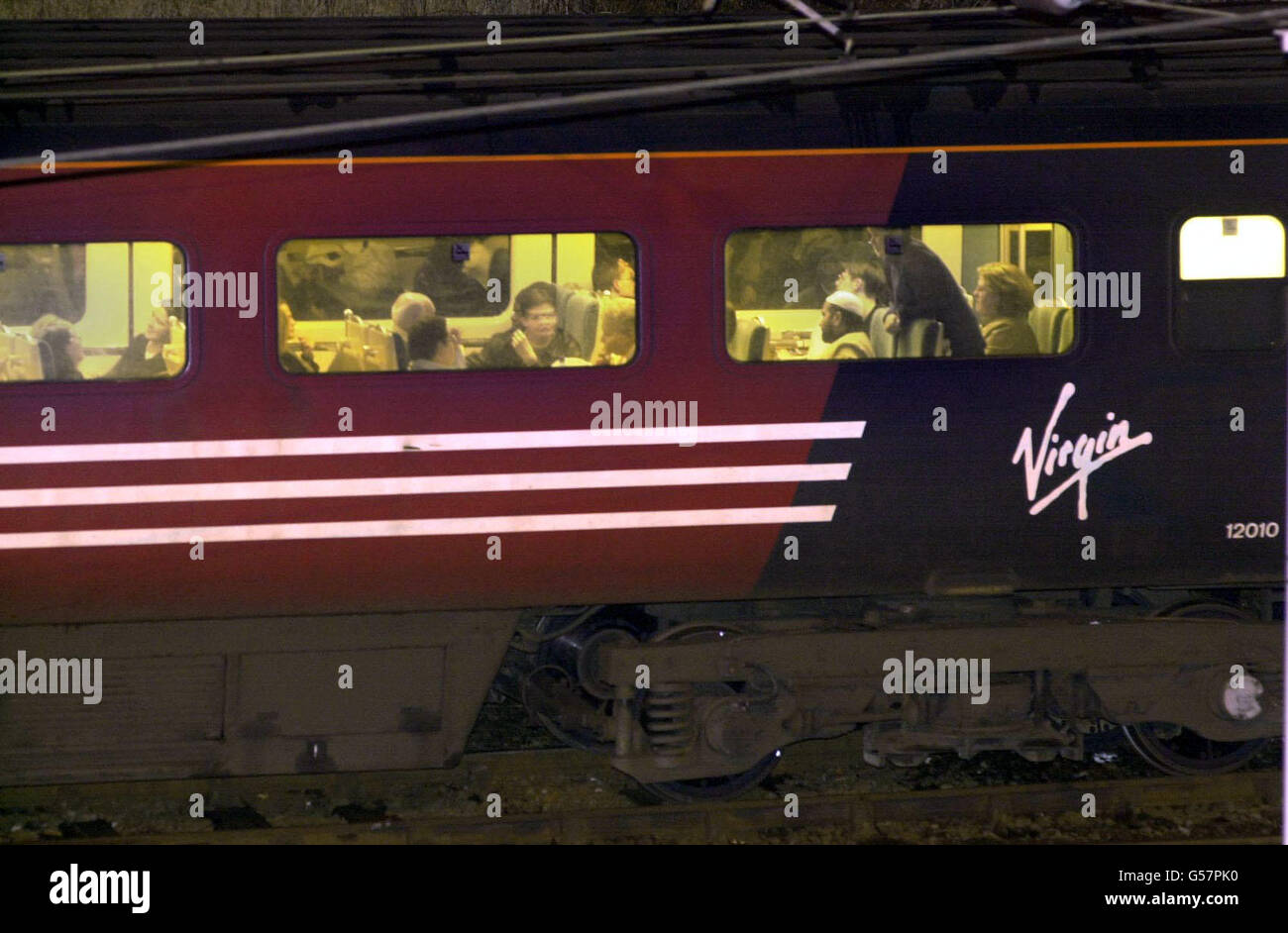 Passengers wait inside their carriage to be evacuated from the Virgin ...