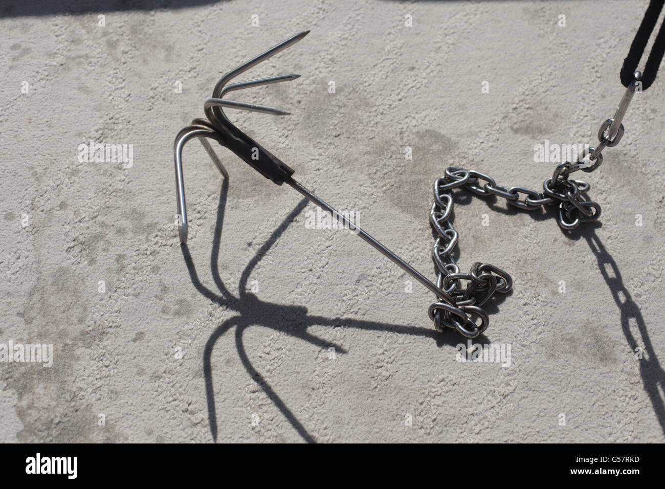 large hook with shadow and chain Stock Photo - Alamy