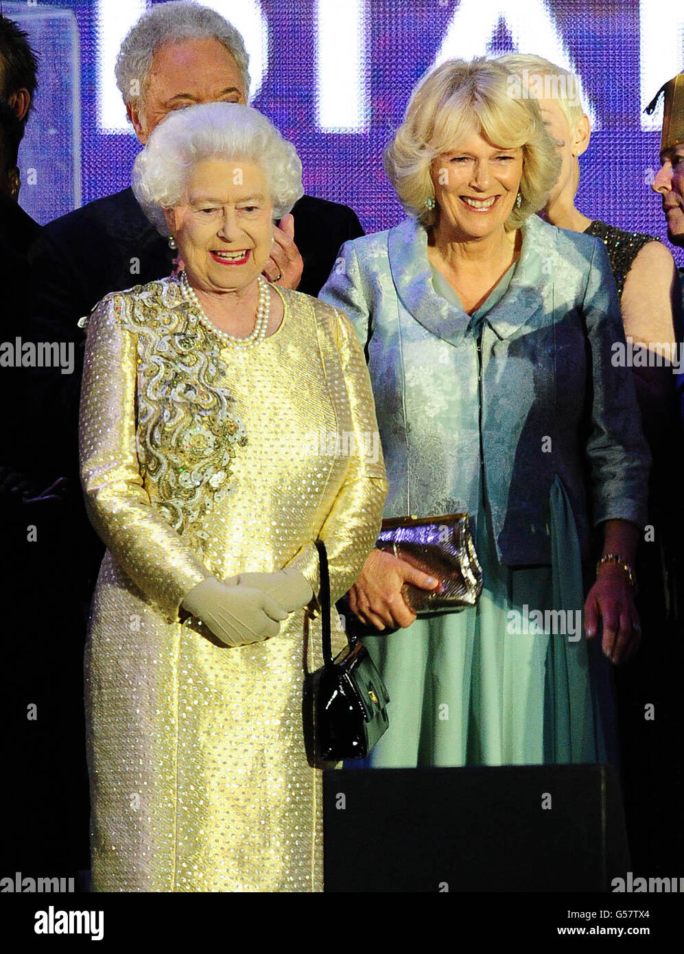 Queen Elizabeth II and the Duchess of Cornwall on stage outside ...