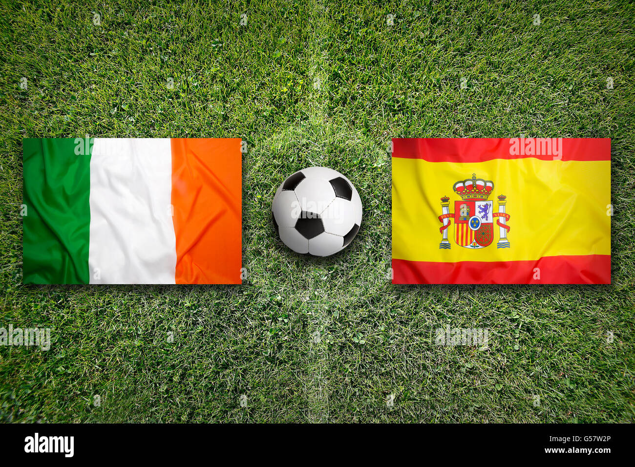 Ireland vs. Spain flags on green soccer field Stock Photo - Alamy