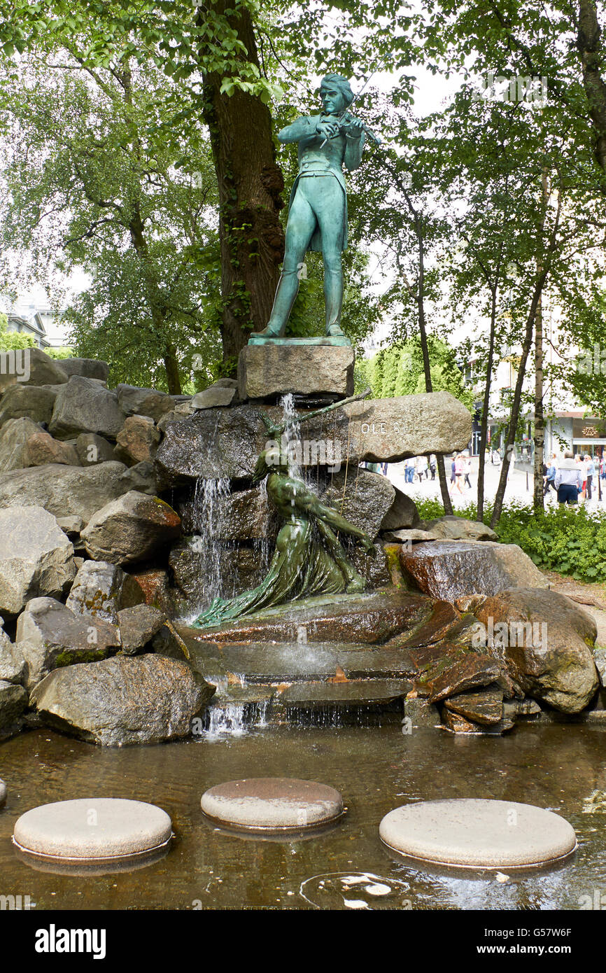 Statue of composer Ole Bull on top of pond with waterfall in Bergen ...