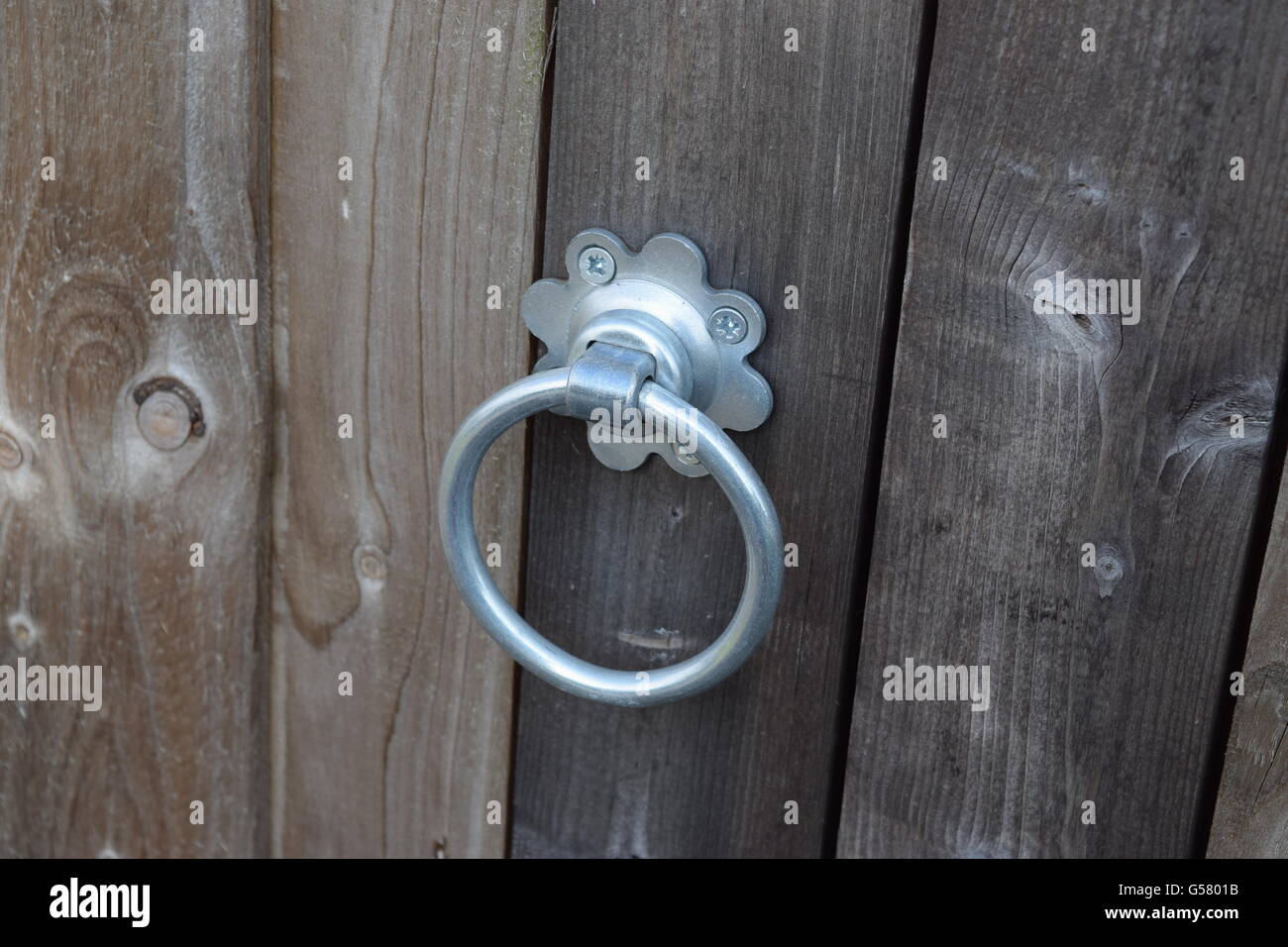 Silver Handle on a Wooden Door Stock Photo - Alamy