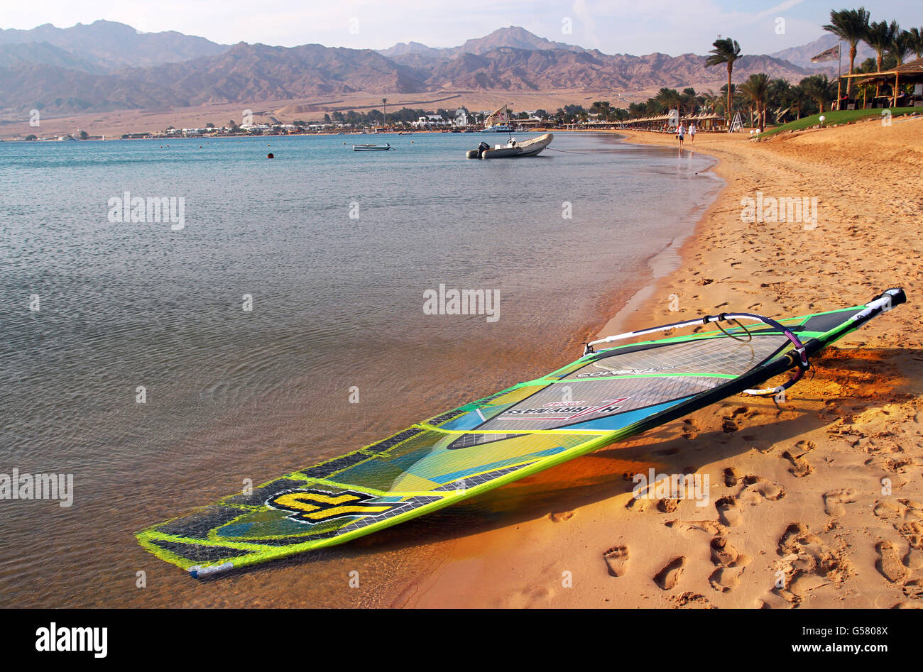 Sail with board for windsurfing on beach Stock Photo - Alamy