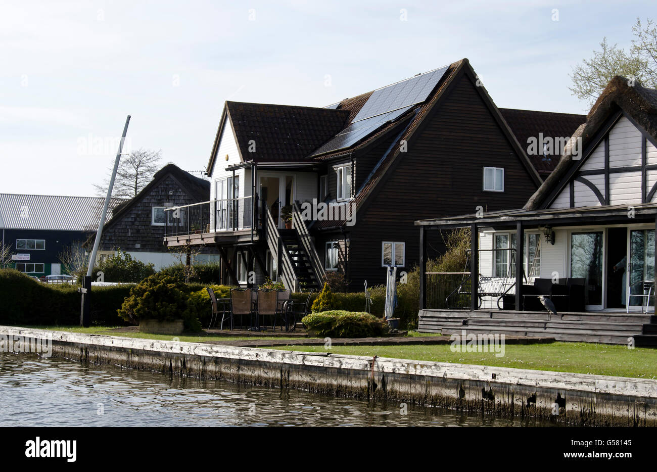 Riverside houses near Horning on the River Bure in the Norfolk Broads ...