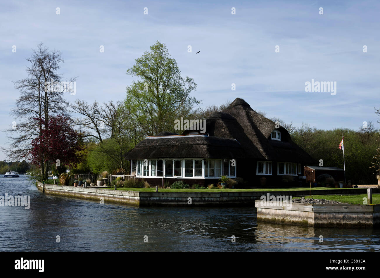 Thatched waterside house near Horning on the River Bure in the Norfolk ...