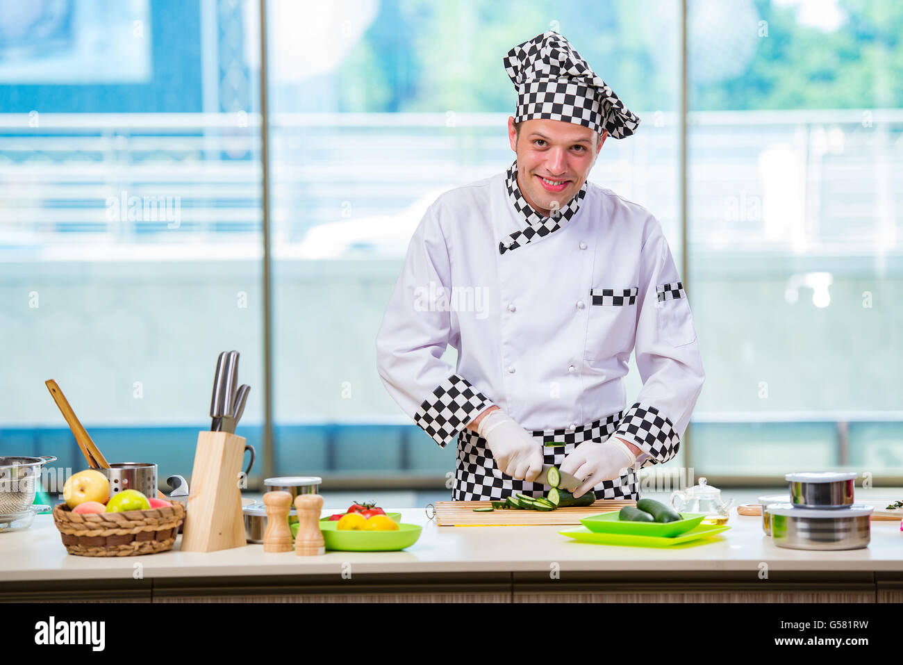 Male cook preparing food in the kitchen Stock Photo - Alamy