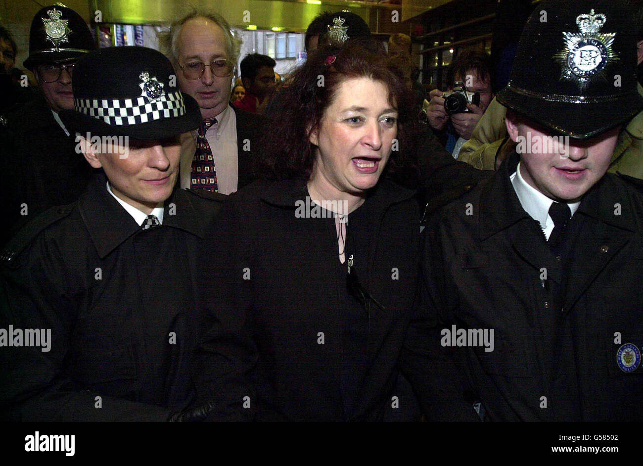 Judith Kilshaw is escorted by Police officers as she leaves Birmingham ...