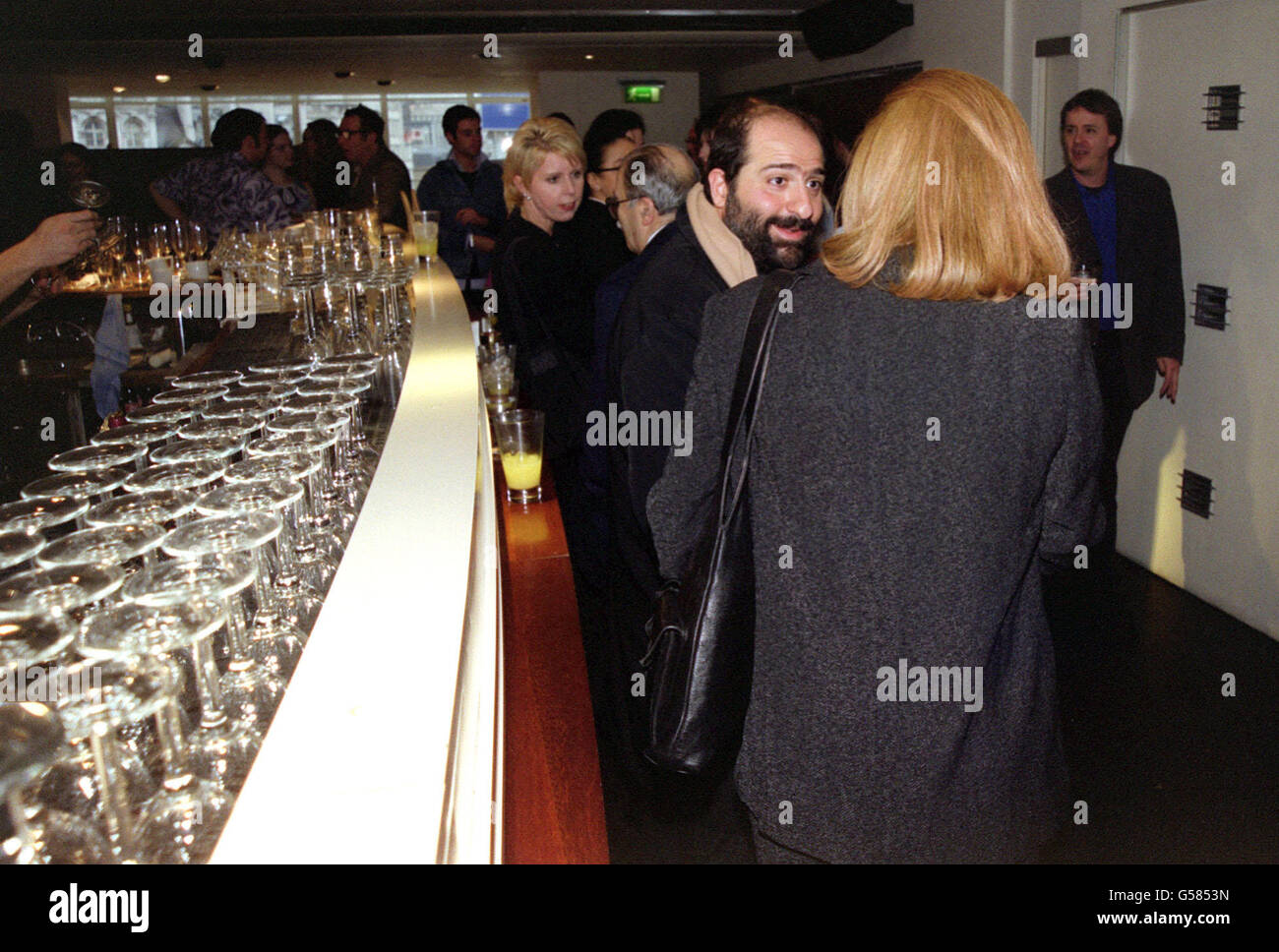 Comedian and actor Omid Djalili (centre, with beard) relaxing at the ...