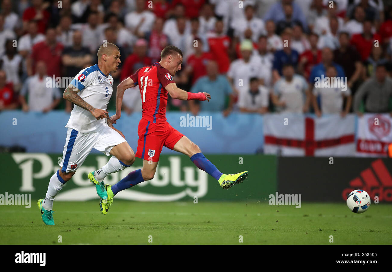 England's Jamie Vardy (right) gets a shot away at goal during the UEFA ...