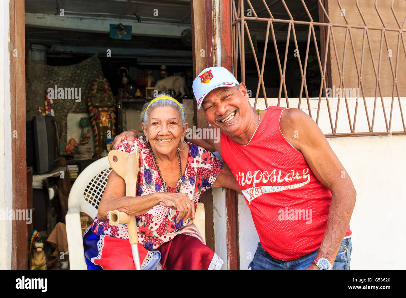 Seniors, Cuban couple happily smiling and chatting in a street scene in ...