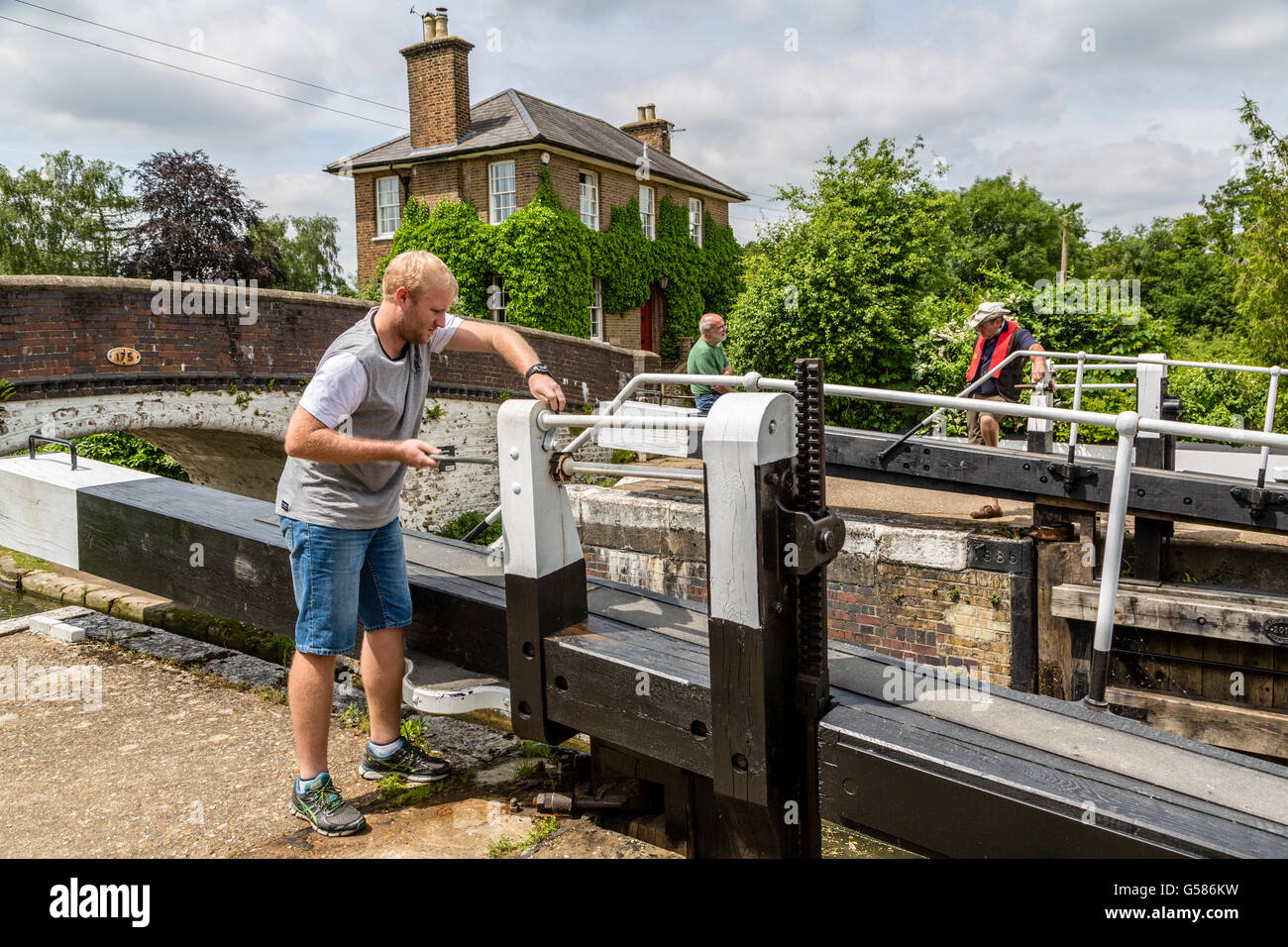 Closing the paddle gate at Stockers Lock Grand Union Canal London ...