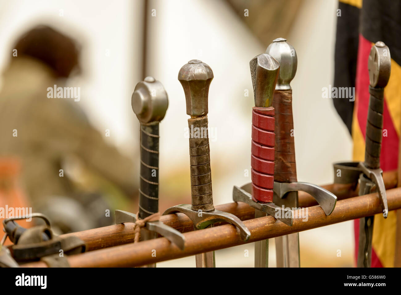 handles of swords to a medieval reenactment Stock Photo - Alamy